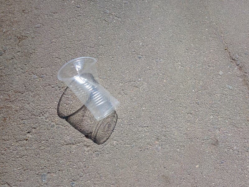 Plastic Cup Left on Pavement Stock Photo - Image of material ...