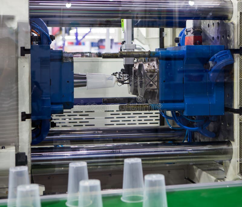 Plastic Cups from Plastic Injection Molding Press Machine Stock Image ...
