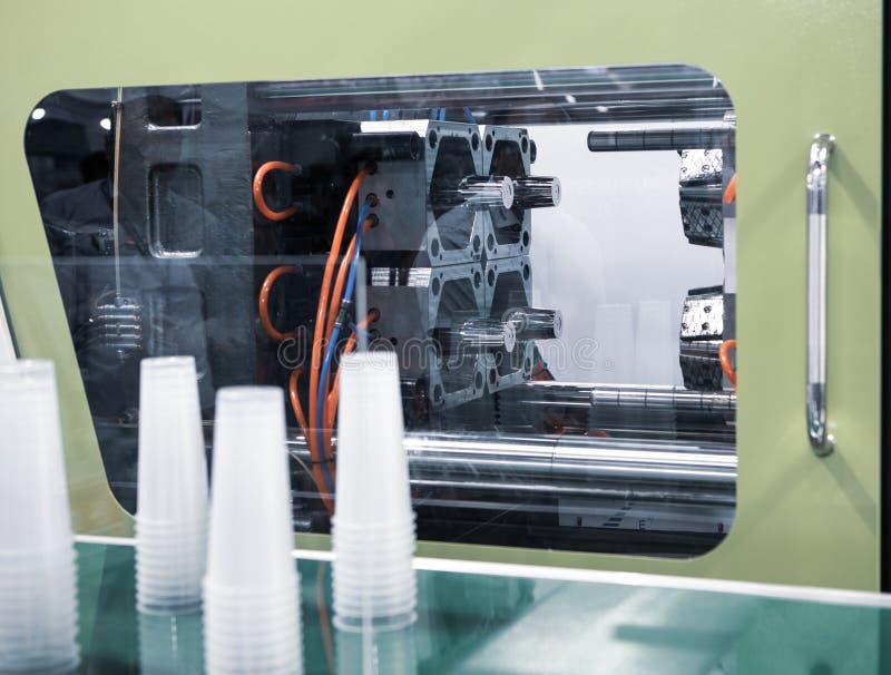 Plastic Cups from Plastic Injection Molding Press Machine Stock Image ...