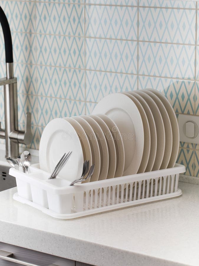 A Plastic Dish Drying Rack Stands at the Sink in the Kitchen with Clean ...