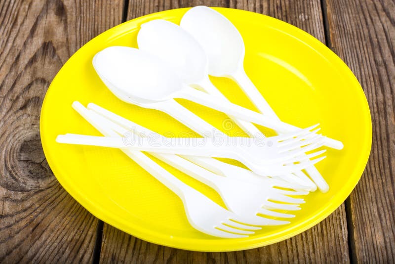 Plastic Disposable Tableware on Wooden Table Stock Image - Image of ...