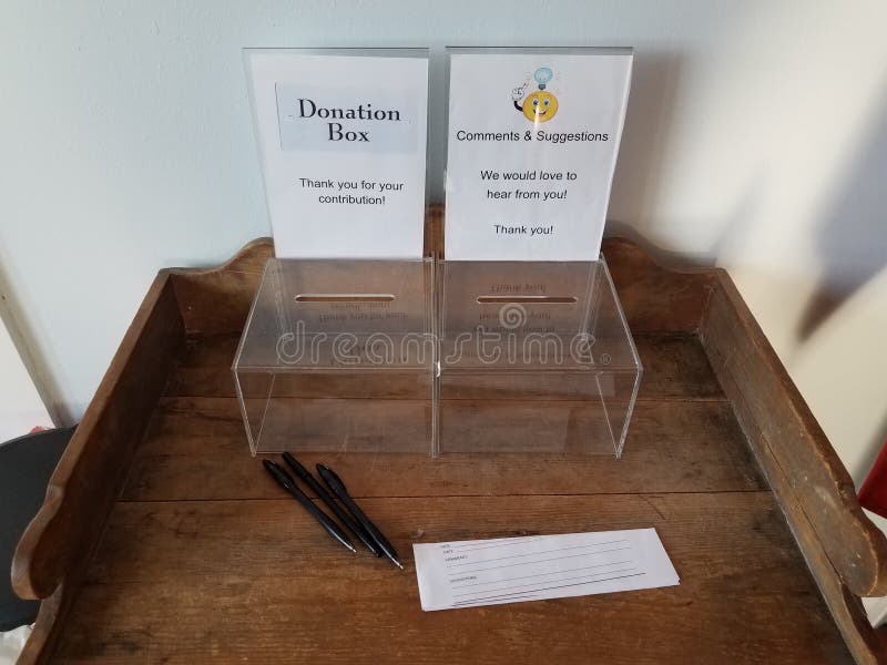 Plastic Donation and Comment Box with Pen and Paper on Desk Stock Image ...