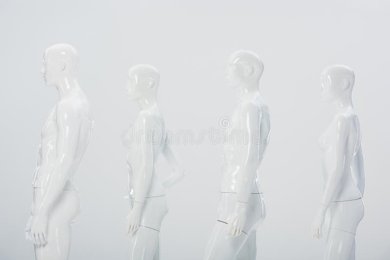 Plastic Dummies in Row Isolated on Grey Stock Photo - Image of ...