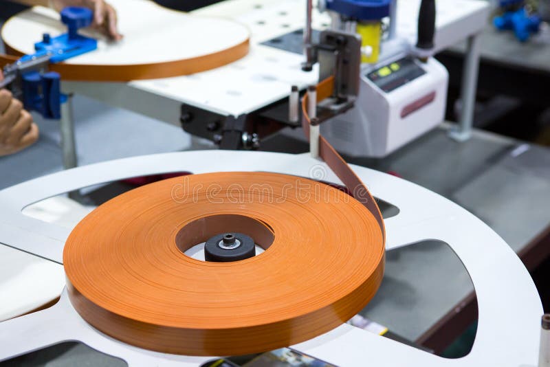 The Plastic Edge Mill is Fed into the Edge Banding Machine Editorial ...