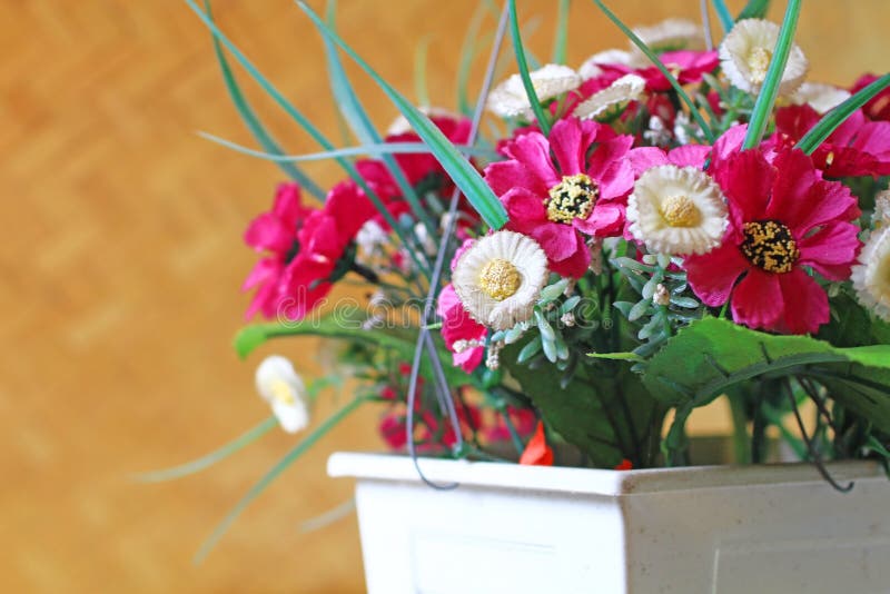 Plastic flowers stock image. Image of beautiful, container - 32584235