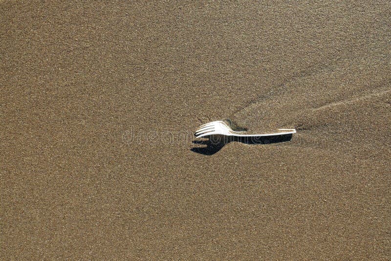 Plastic Fork on Beach; Ocean Pollution Stock Image - Image of impact ...