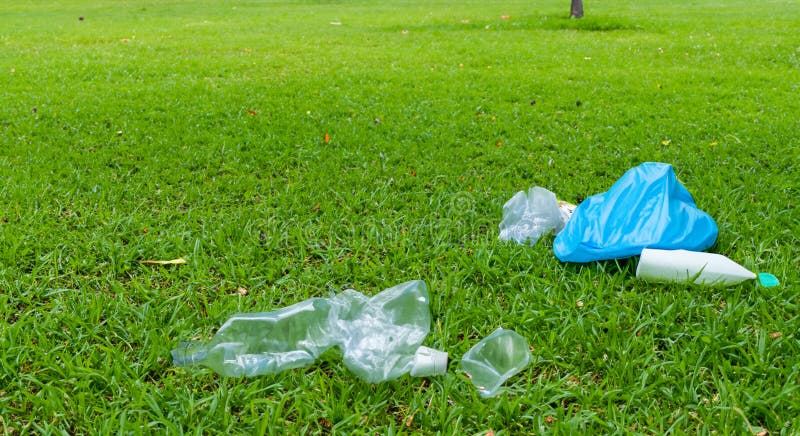 Plastic Garbage Left in the Park on a Green Lawn. the Concept of ...