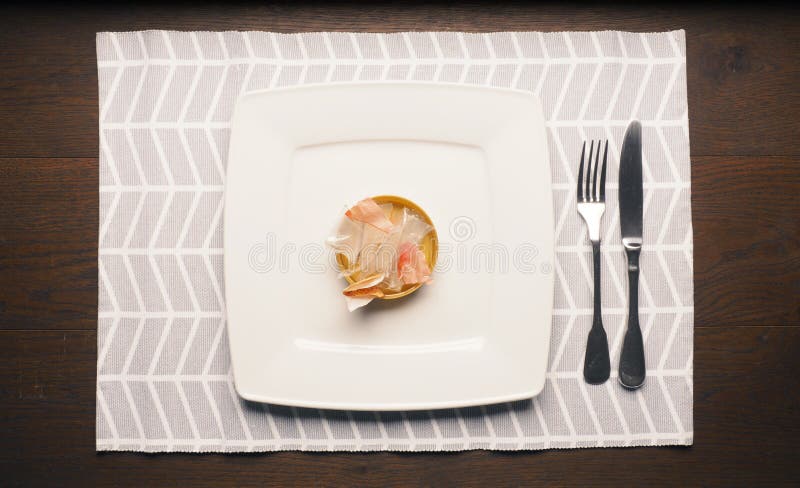 Plastic Garbage on a Plate with Cutlery on a Wooden Table Stock Photo ...