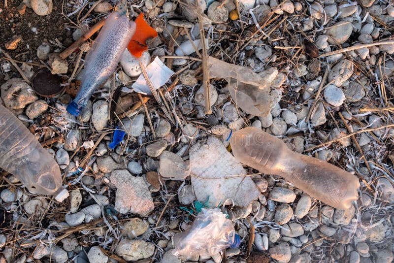 Plastic Garbage on the Seashore. Top View of a Polluted Beach. Stones ...