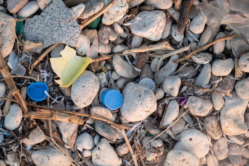 Plastic Garbage on the Seashore. Top View of a Polluted Beach. Stones ...