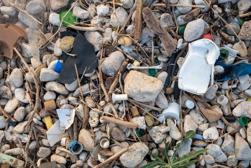 Plastic Garbage on the Seashore. Top View of a Polluted Beach. Stones ...