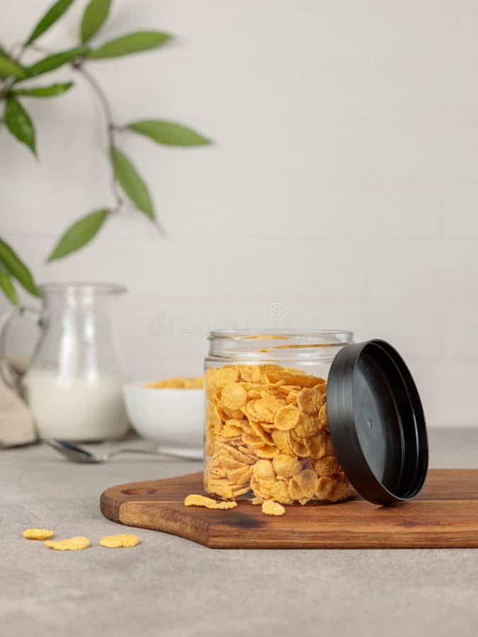 Plastic or Glass Container with Cornflakes for Breakfast. Vertical ...