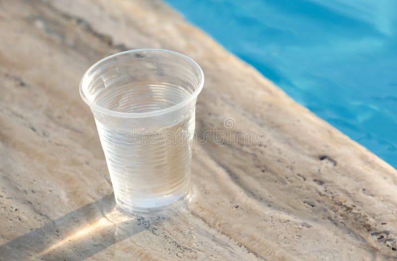 Plastic Glass with Water Near the Pool Stock Photo - Image of poolside ...