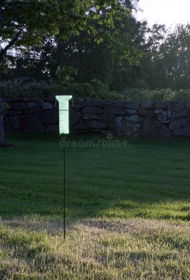 Plastic green rain-gauge stock photo. Image of garden - 55503074