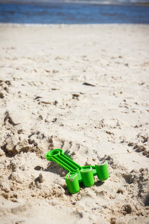 Plastic Green Rake for Relax or Playing at Beach. Vacation Time and ...