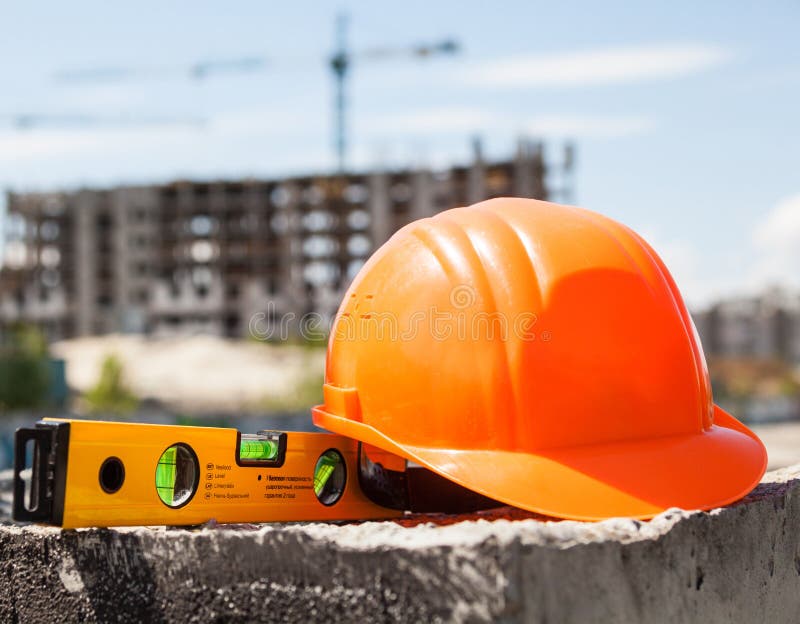 Plastic Hard Hat and Spirit Level Stock Image - Image of builder ...
