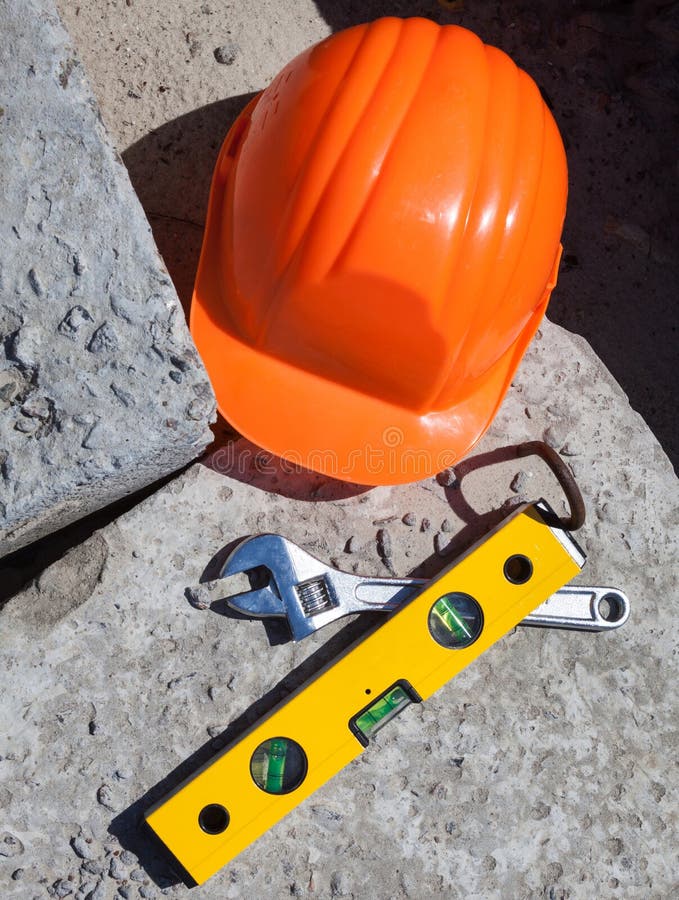 Plastic Hardhat, Spirit Level and Adjustable Spanner Stock Image ...