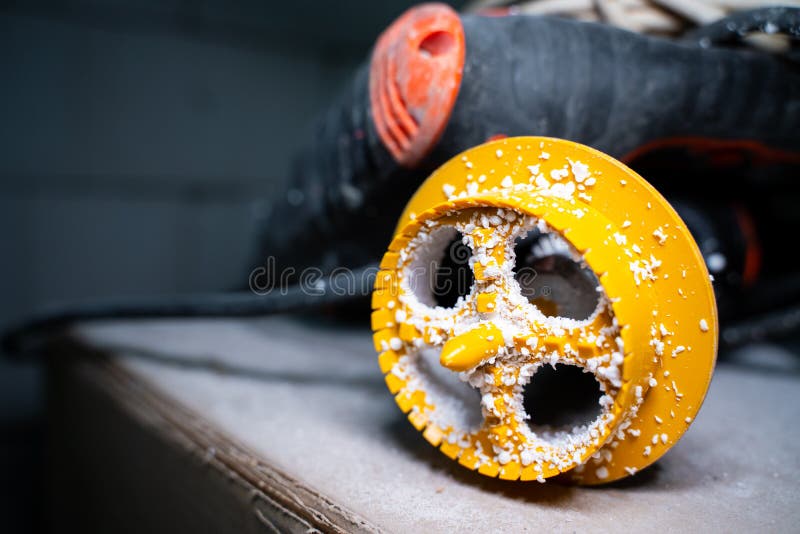 Plastic Hole Cutter for EPS Board Installation Close-up in Foam Chips ...