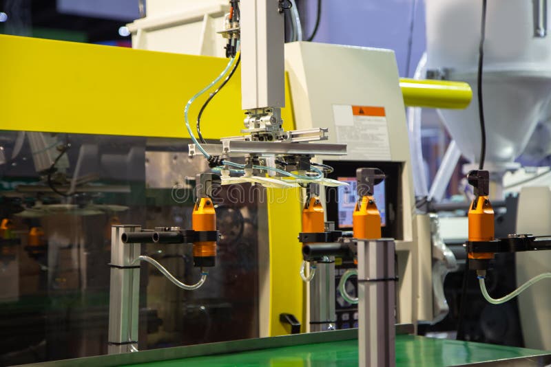 Plastic Injection Molding Machine in the Process of Creating a Brick ...