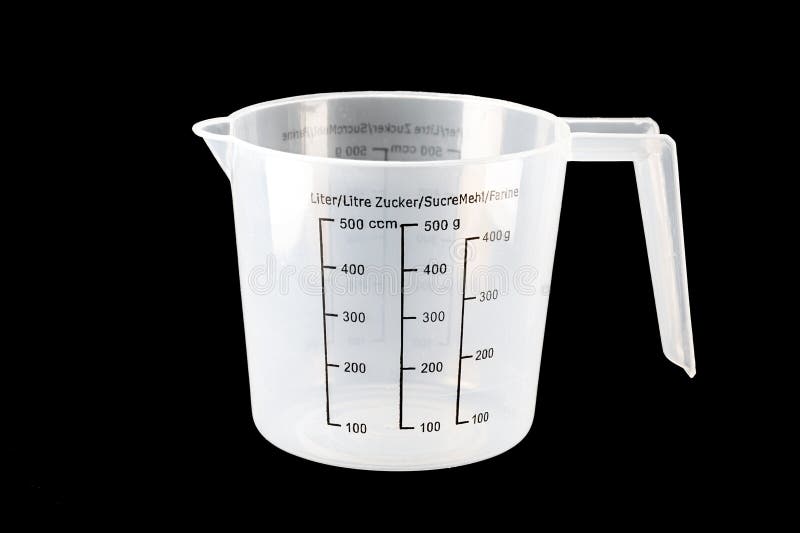 Plastic Kitchen Measuring Cup on Isolated Black Background. Close-up ...