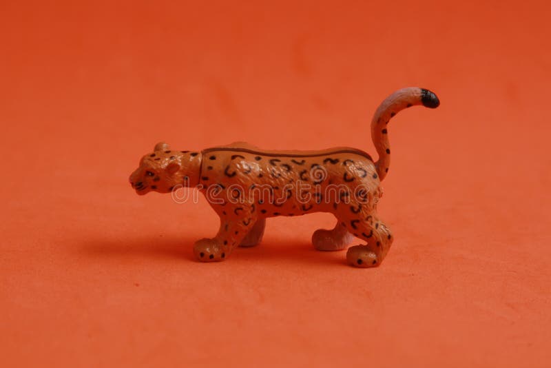 Plastic Leopard Toy on Orange Surface Stock Image - Image of africa ...