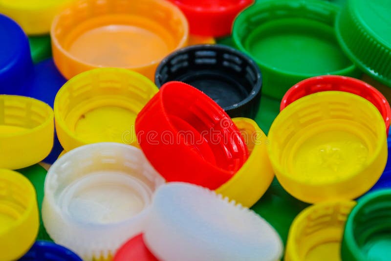 Plastic Lids of Different Colors on a White Background Stock Image ...