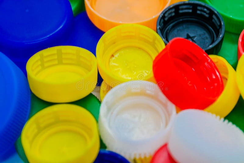 Plastic Lids of Different Colors on a White Background Stock Image ...
