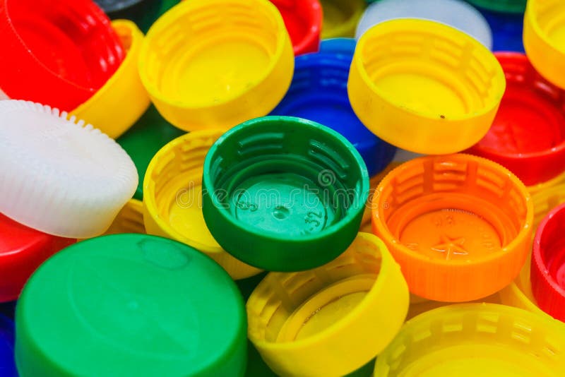 Plastic Lids of Different Colors on a White Background Stock Image ...