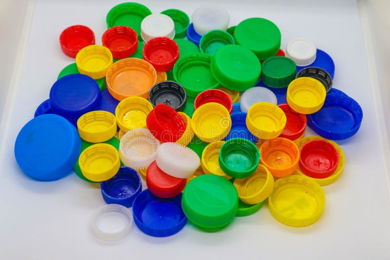 Plastic Lids of Different Colors on a White Background Stock Photo ...
