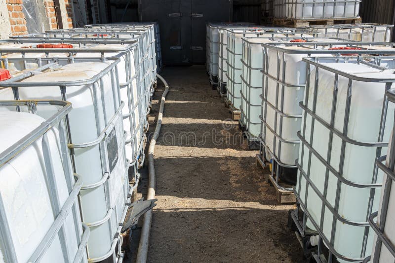 Plastic Liquid Containers in the Warehouse Close-up Stock Image - Image ...