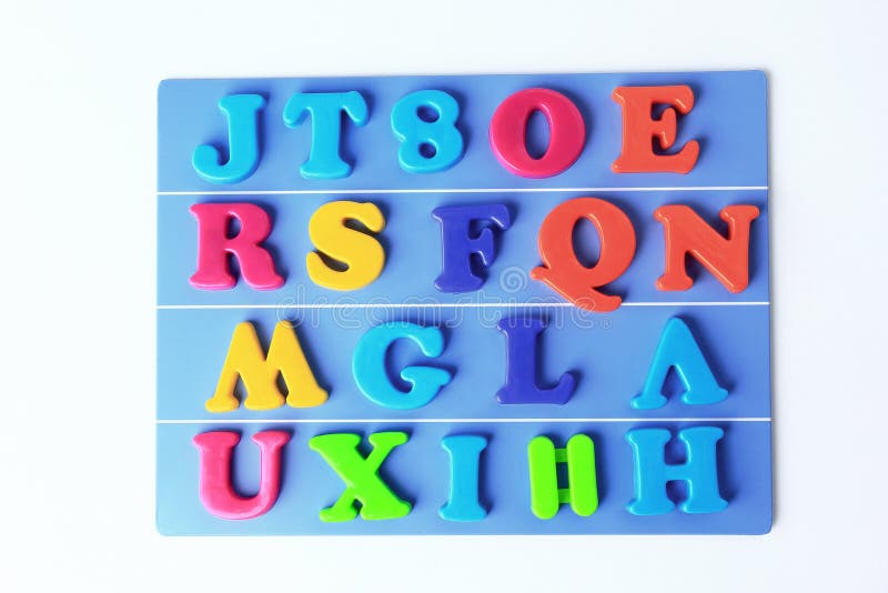 Plastic Magnetic Colored English Alphabet on Blue Background Stock ...