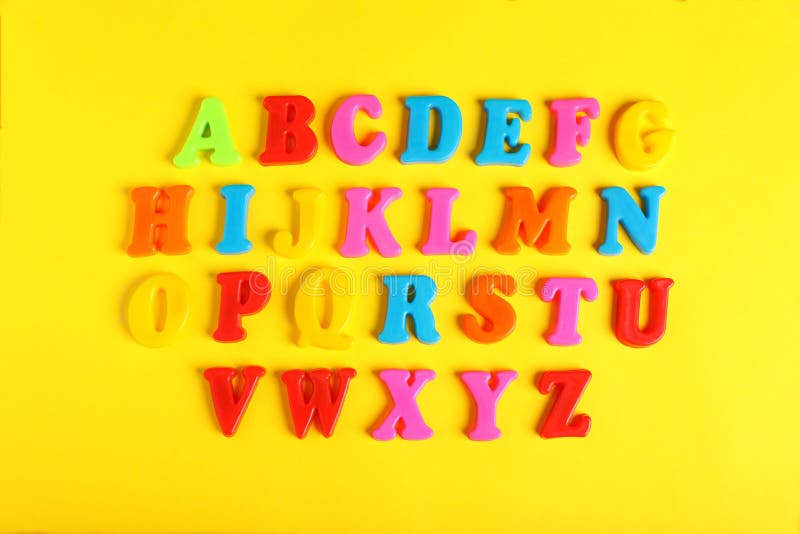 Plastic Magnetic Letters on Yellow Background, Flat Lay. Alphabetical ...