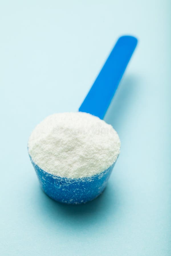 Plastic Measuring Spoon with Milk Powder, Close-up Stock Photo - Image ...