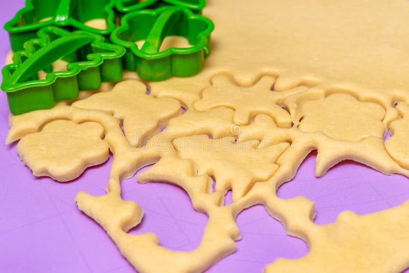 Plastic Molds for Forming Cookies Near the Rolled Dough. Making Cookies ...