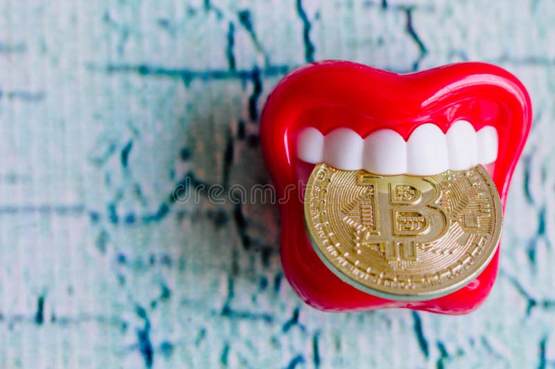 Plastic Mouth with Biting Bitcoin Coin Stock Photo - Image of business ...