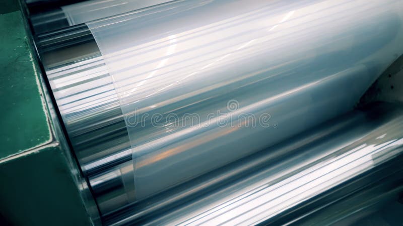 Plastic is Moving through the Rolling Mechanism in a Top View Stock ...