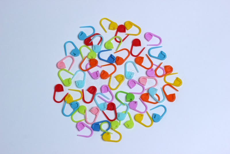 Plastic Multi-colored Knitting Pins. Colorful Pins on the White ...