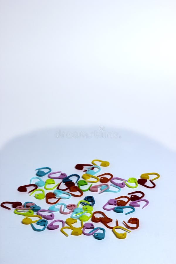 Plastic Multi-colored Knitting Pins. Colorful Pins on the White ...