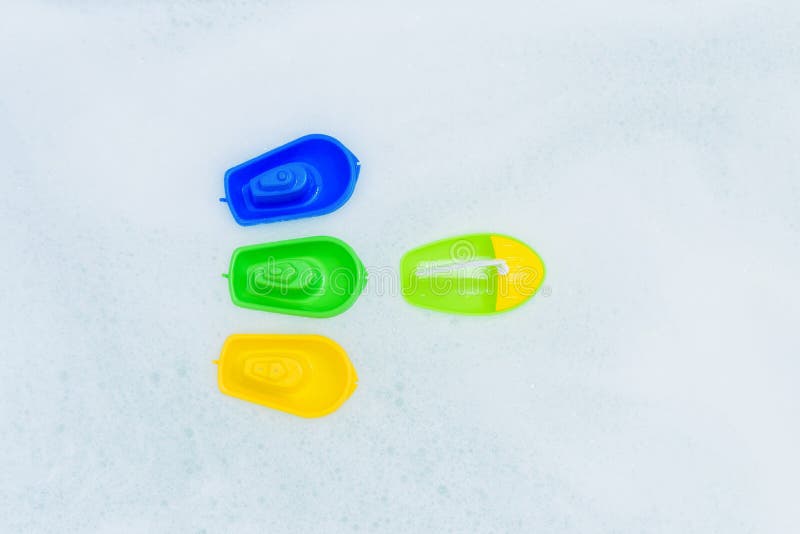 Plastic Multicolored Toy Boats on Foam Bath. Stock Image - Image of ...