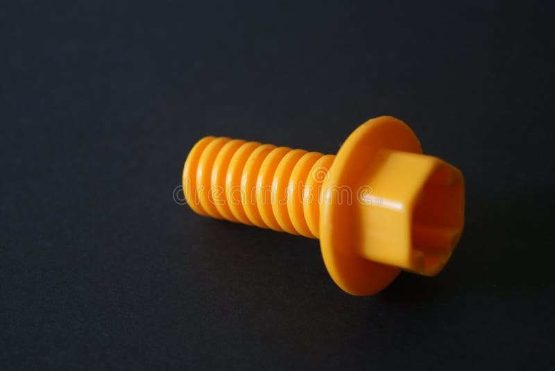 Plastic Orange Isolated Bolt Nut Tool on Black Background Stock Image ...