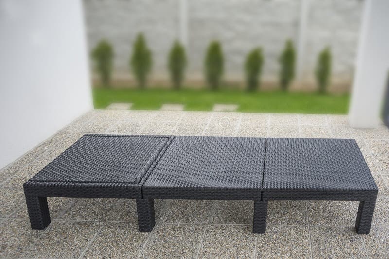 Plastic Outdoor Rattan Bed on a Patio Stock Image - Image of chair ...