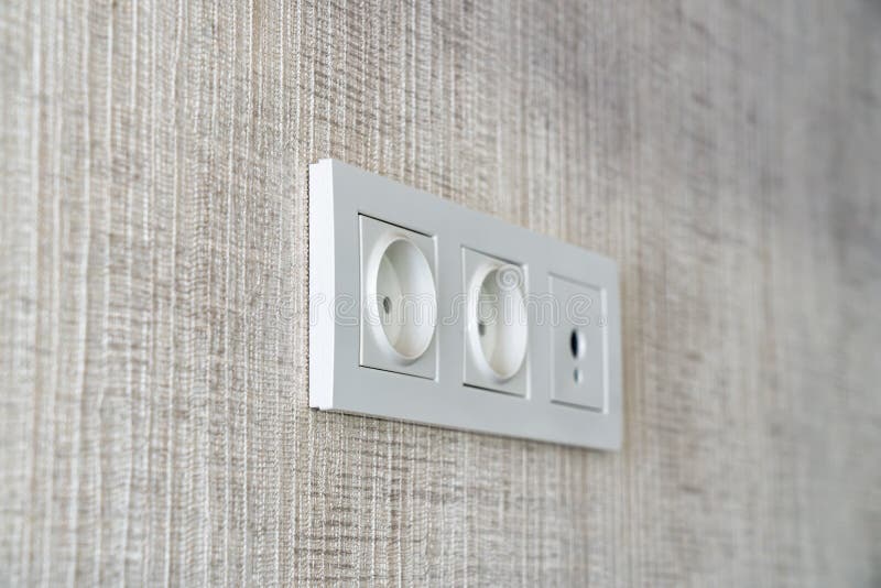 Plastic Panel with Electrical Sockets and Cable Connectors on the Wall ...