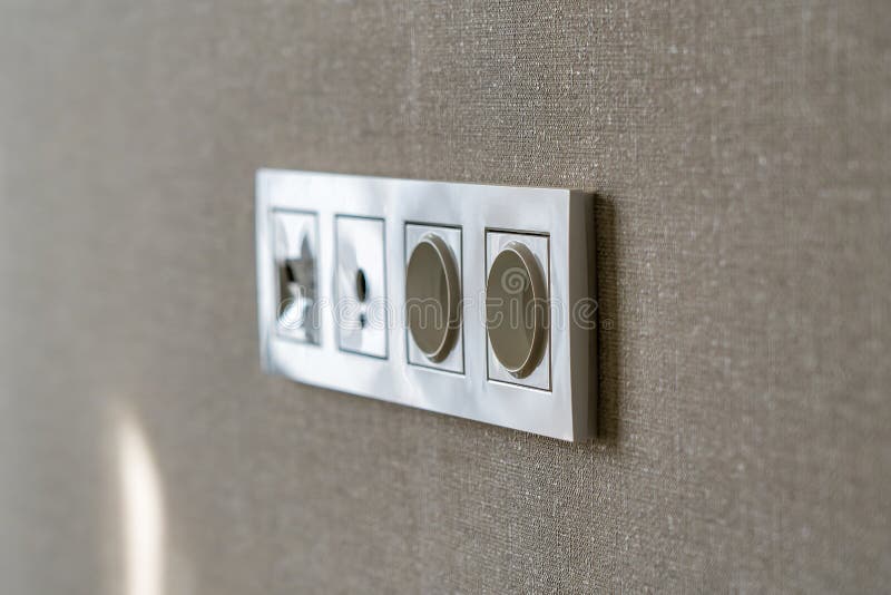 Plastic Panel with Electrical Sockets and Cable Connectors on the Wall ...