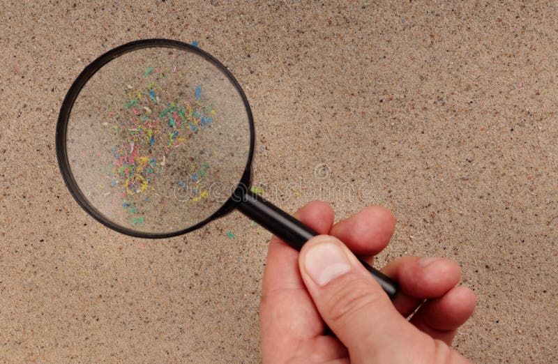 Plastic Particles in the Sand on the Beach, Under a Magnifying Glass ...