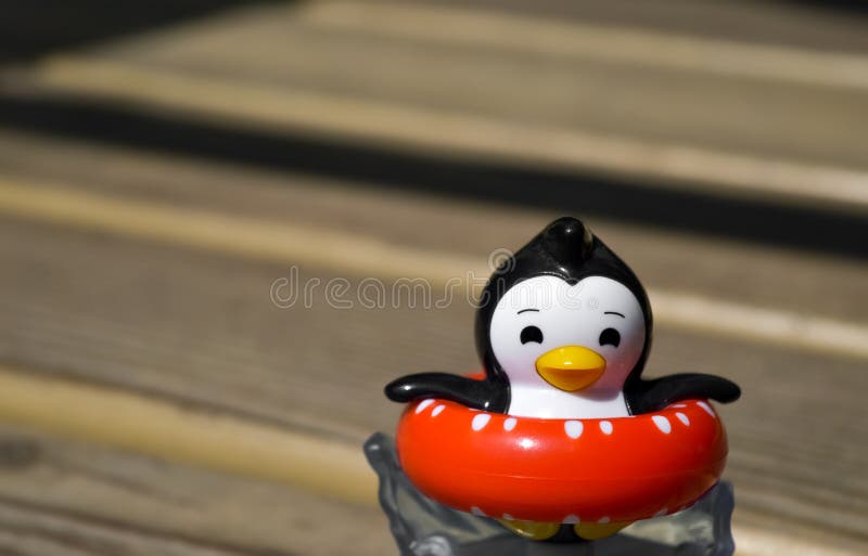 Plastic Penguin Toy with Red Rubber Ring for Swimming Stock Image ...