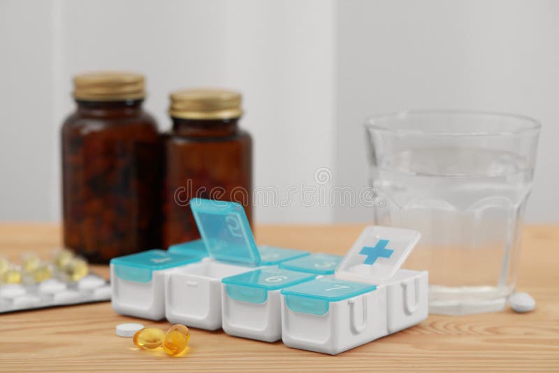 Plastic Pill Box and Different Medicaments on Wooden Table Stock Image ...