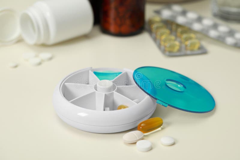 Plastic Pill Box and Different Medicaments on White Table, Closeup ...
