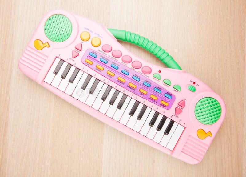 Plastic Pink Toy Piano Wooden Table Stock Image - Image of isolated ...