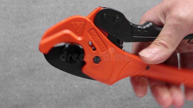 Plastic Pipe Cutter with Ratchet Cuts Polyethylene Pipe. Stock Video ...