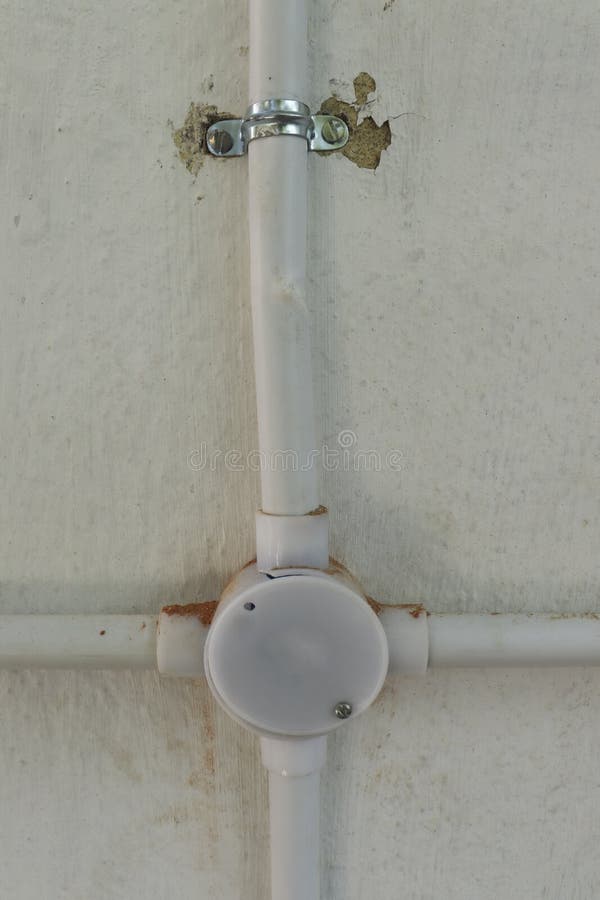 Plastic Pipe and Four Angle Side Pipe Attached on the Wall and Clamp ...